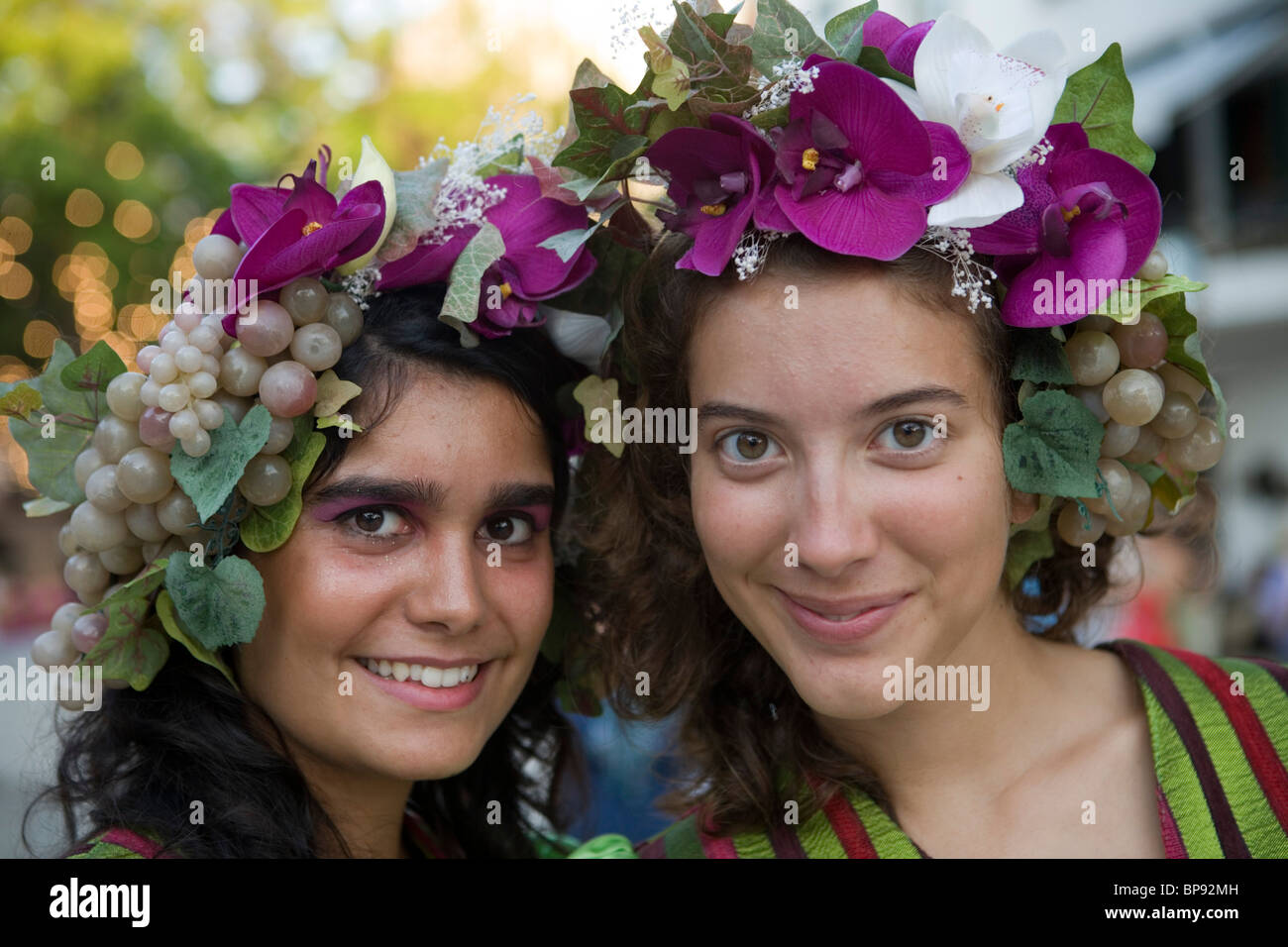 Two young women in colourful costumes at the Madeira Wine Festival ...