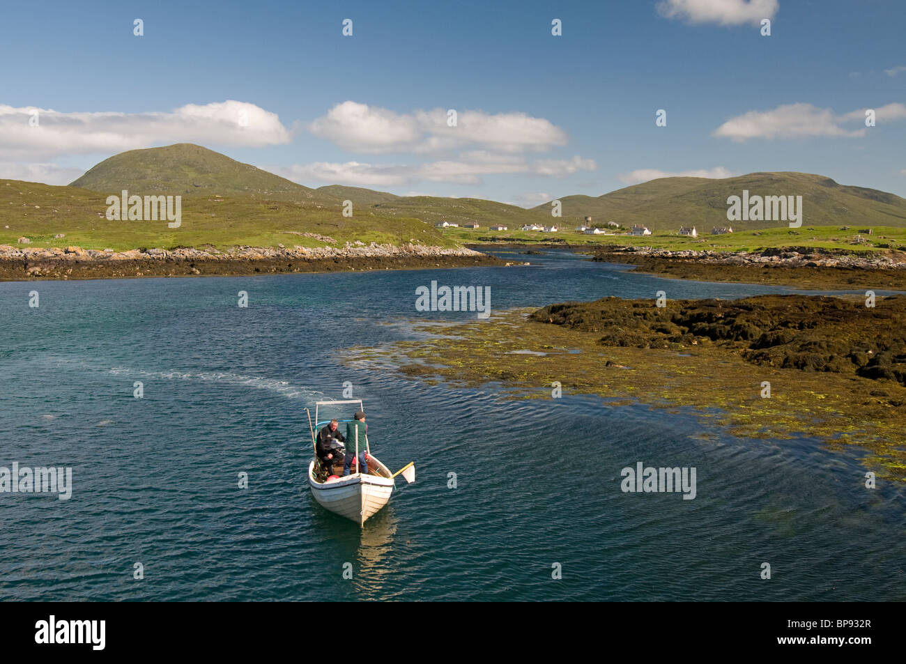 A fisheman returns to the harbour pier at Leverburgh, Outer Hebrides ...