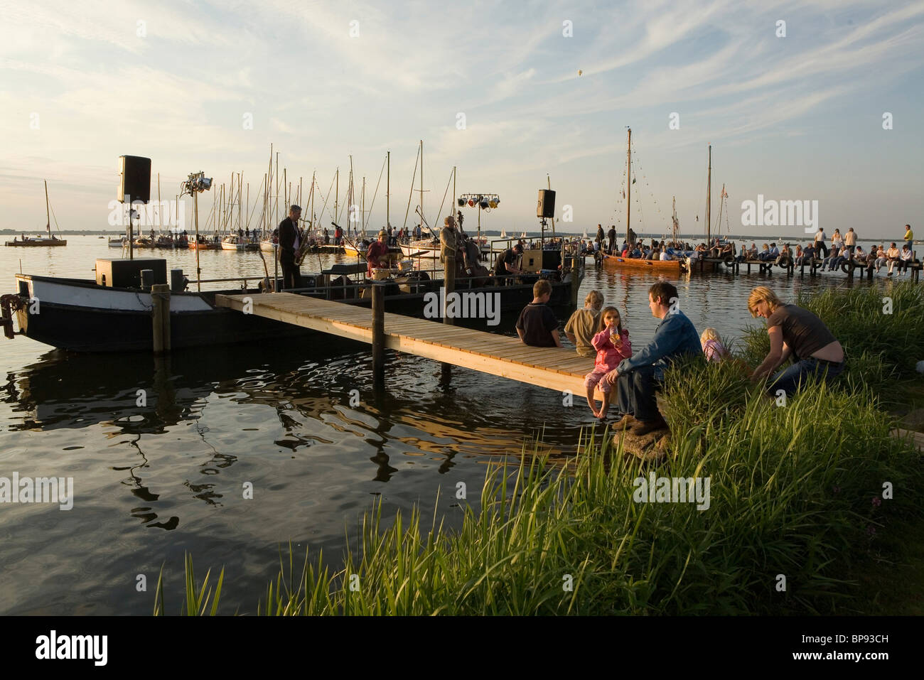 tourists, visitors waiting for a boat tour to Wilhelmstein island ...