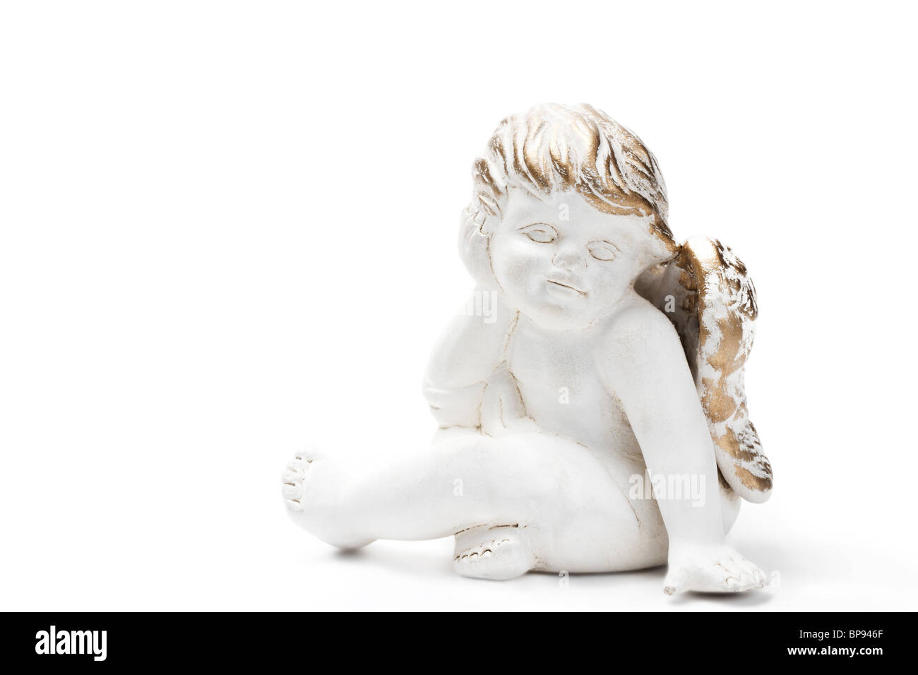 white golden thinking Christmas angel figurine on white background ...