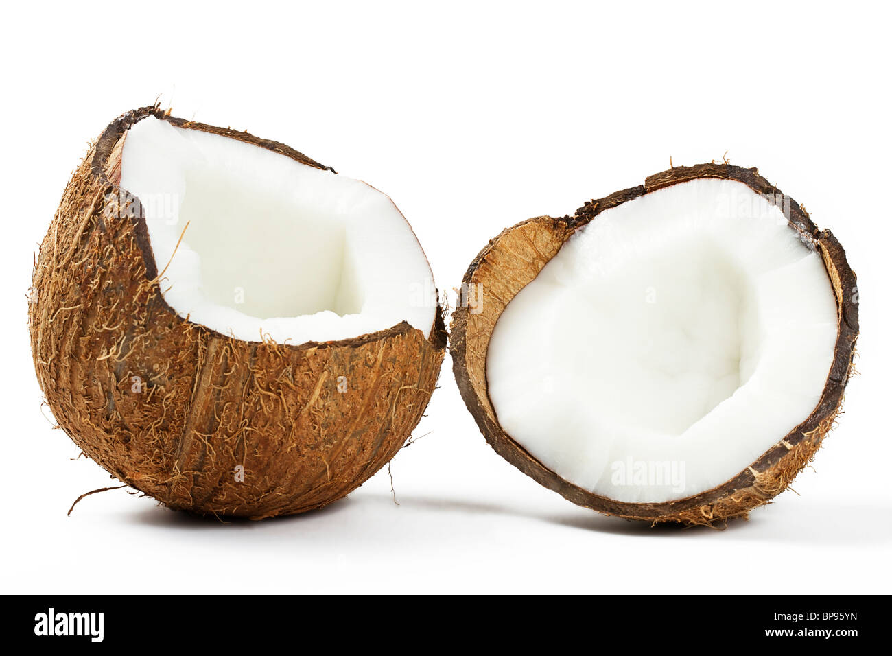 one cracked coconut on white background Stock Photo - Alamy