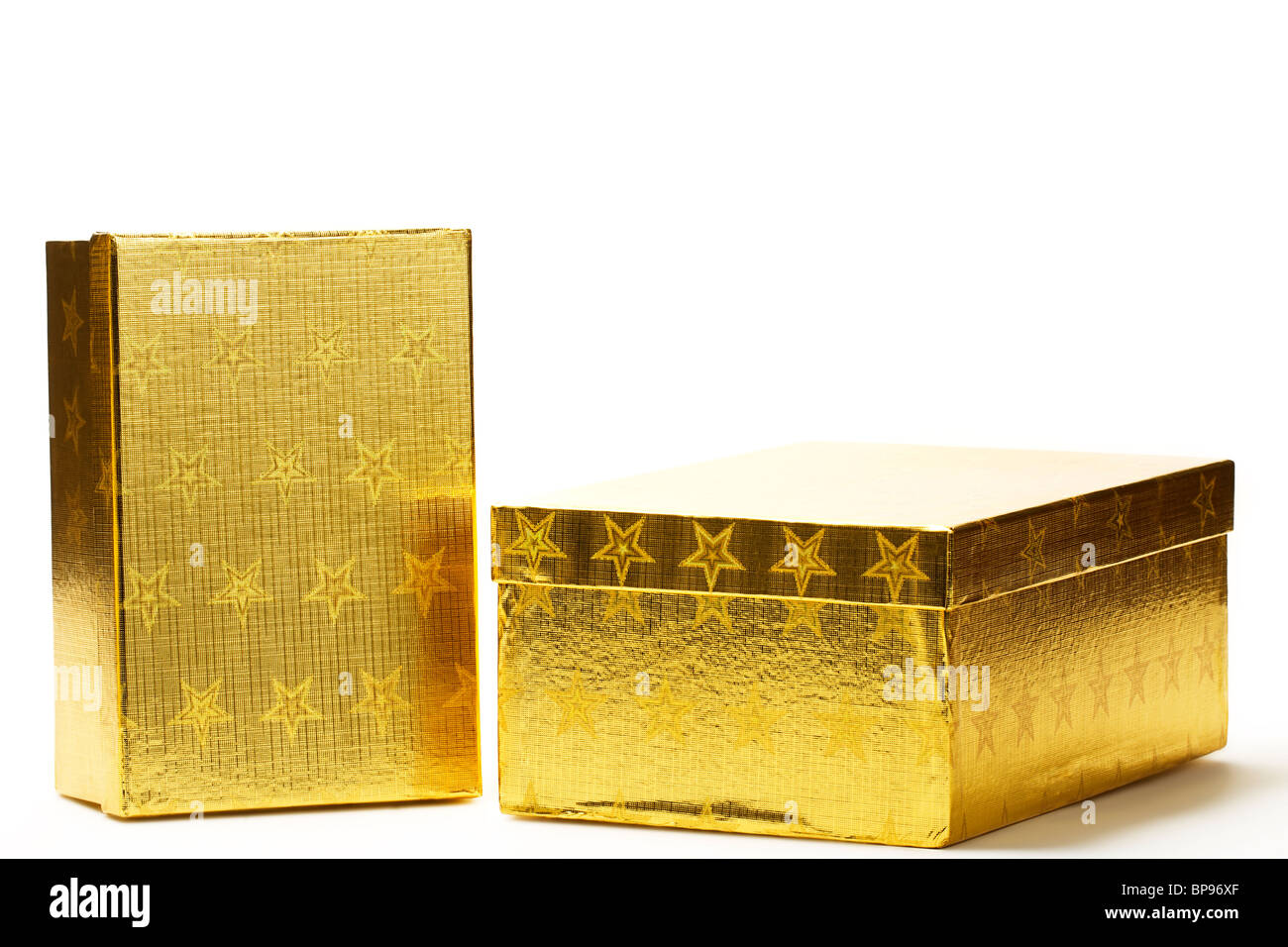 two closed golden present boxes with stars on white background Stock ...