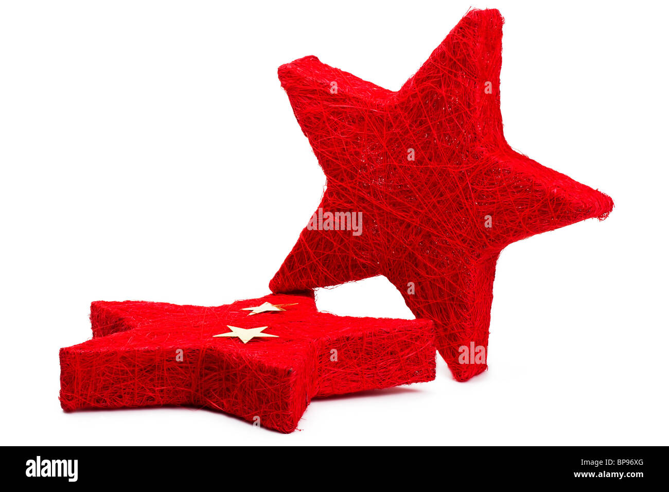 two red thread stars, one lies, on white background Stock Photo - Alamy