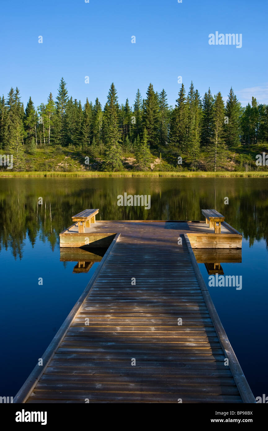 A vertical image of a wooden boat dock Stock Photo - Alamy
