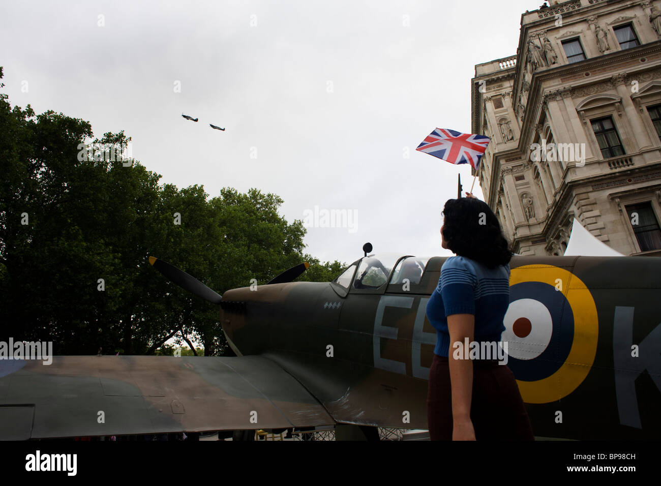 Flypast by two Spitfires over replica and waving 40s lady at the 70th ...