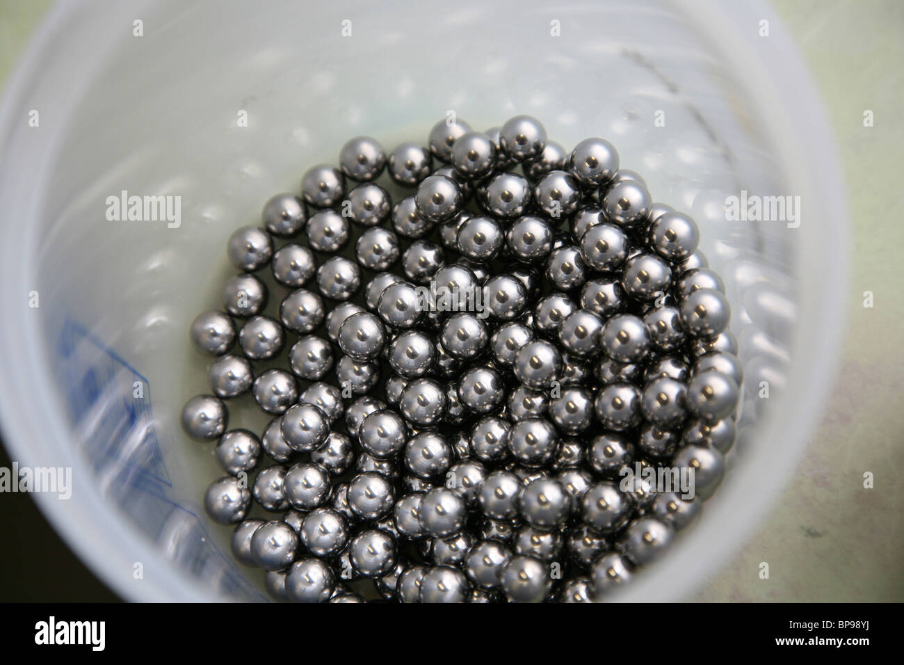 Bucket of ball bearings Stock Photo - Alamy