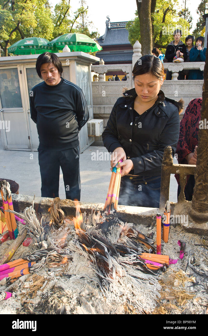 Lighting incense at the Temple of Mystery (Xuan miao guan), Suzhou ...