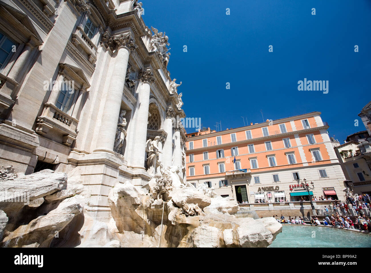 Tourists in front of the Trevi Fountain in the Trevi Square, Rome ...
