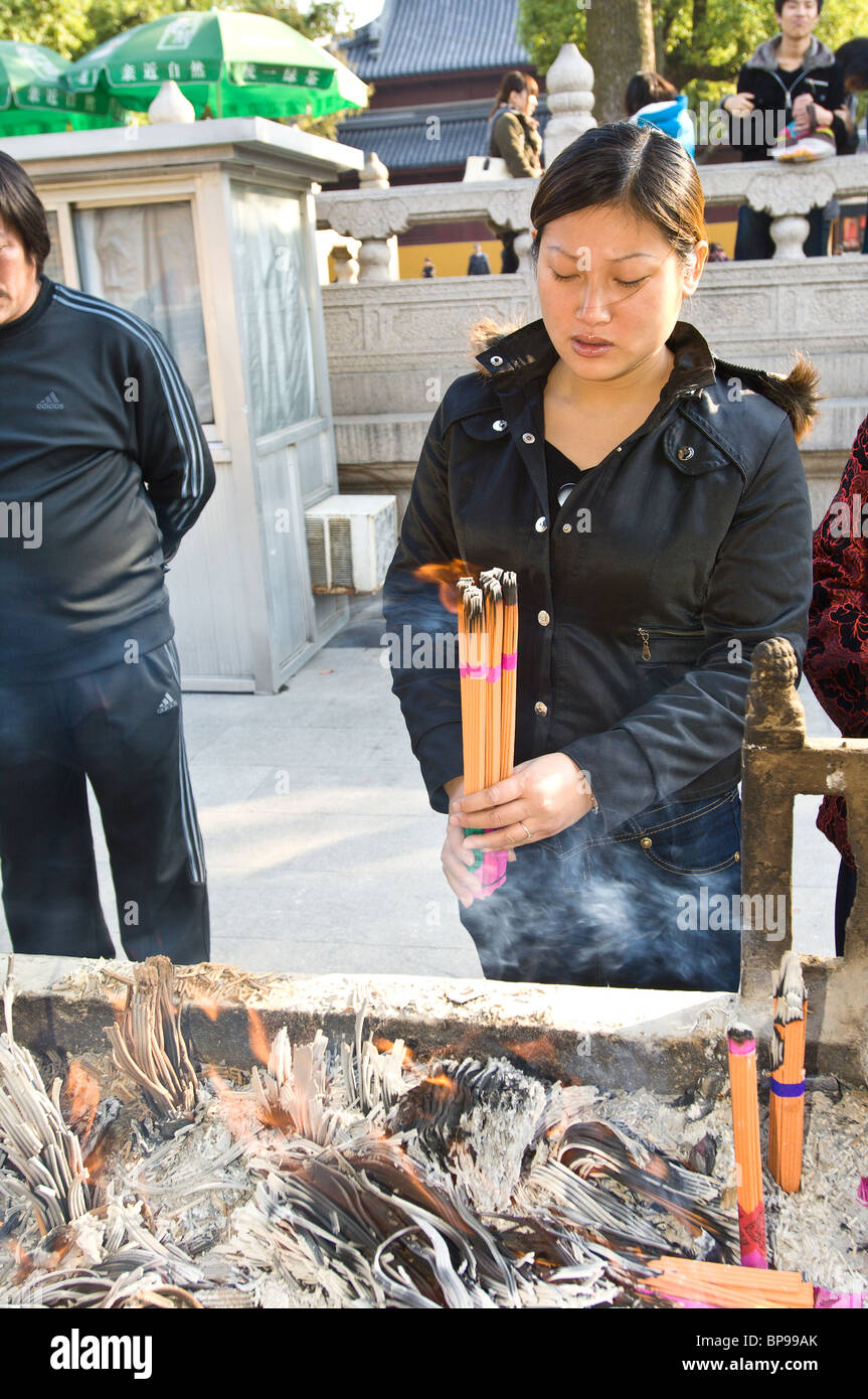 Lighting incense at the Temple of Mystery (Xuan miao guan), Suzhou ...