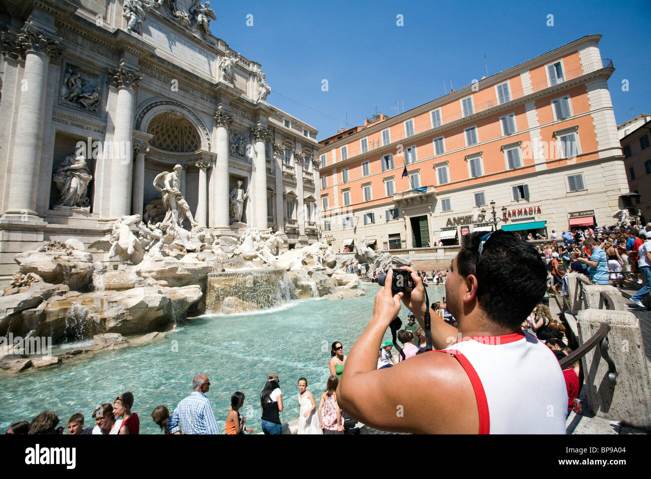 Tourists in front of the Trevi Fountain in the Trevi Square, Rome ...