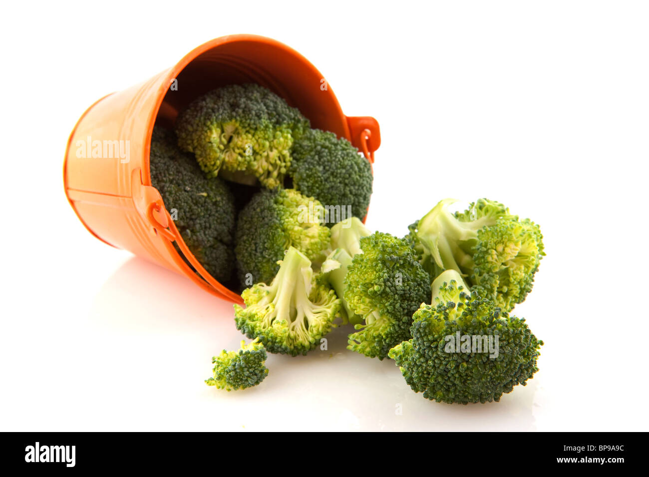 Orange metal buckete full with fresh broccoli Stock Photo - Alamy