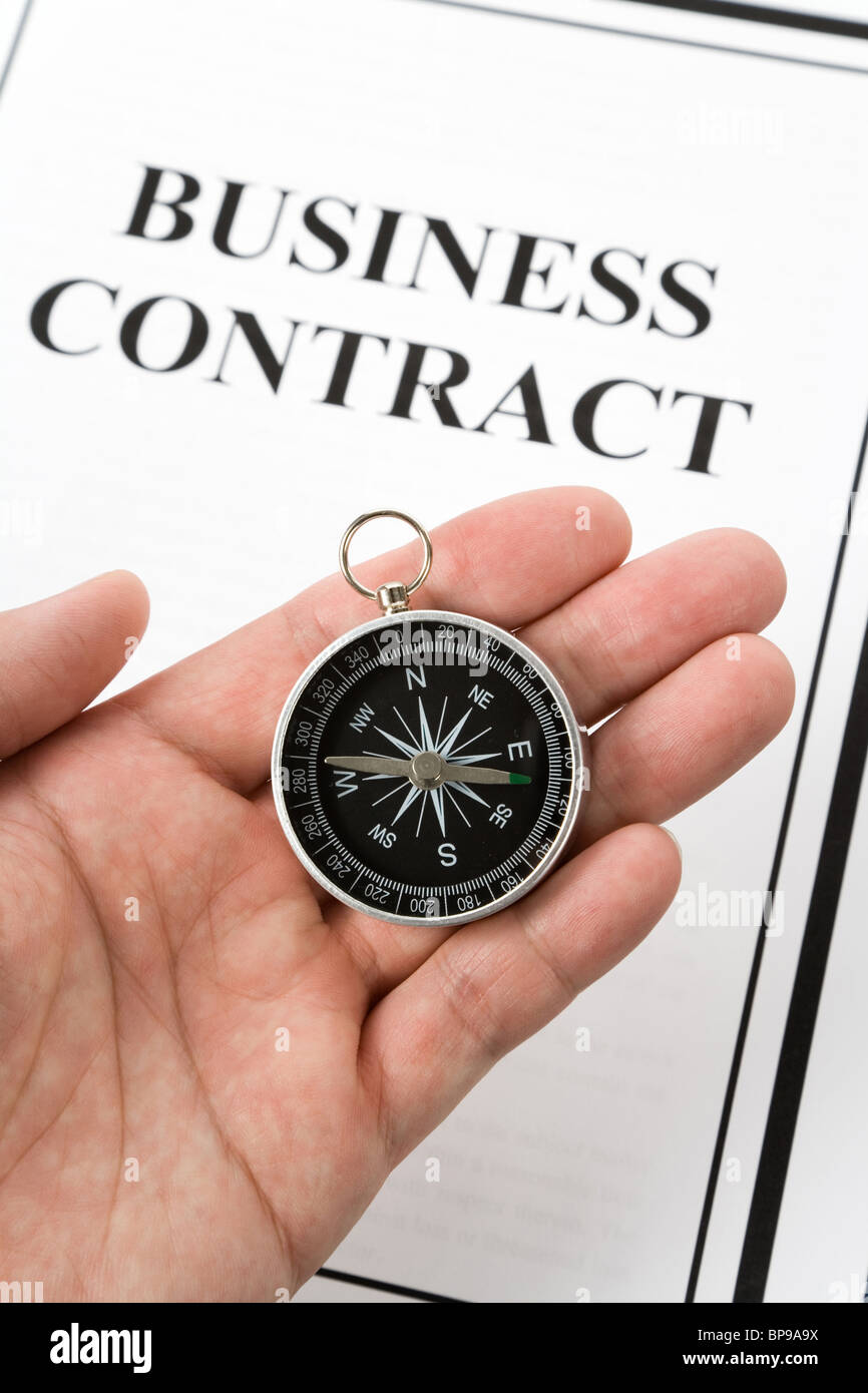 Business Contract and Compass, business concept Stock Photo - Alamy