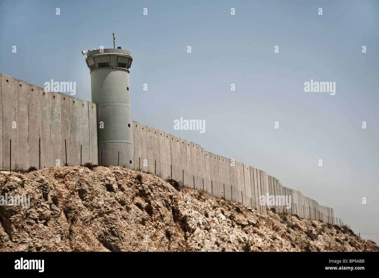 The Israeli separation wall cuts through Palestinian land near the West ...