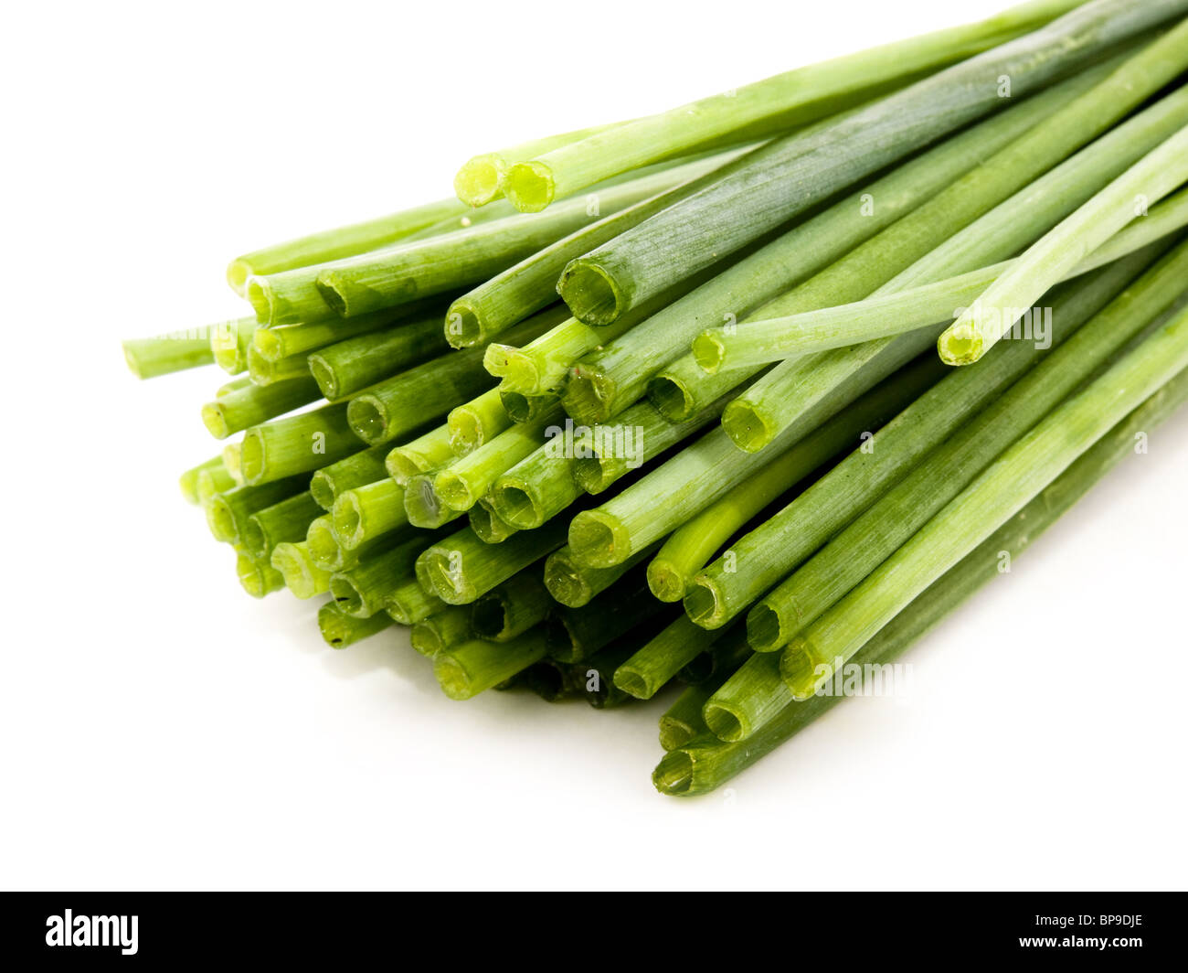 Closeup picture of fresh chives on white background Stock Photo - Alamy