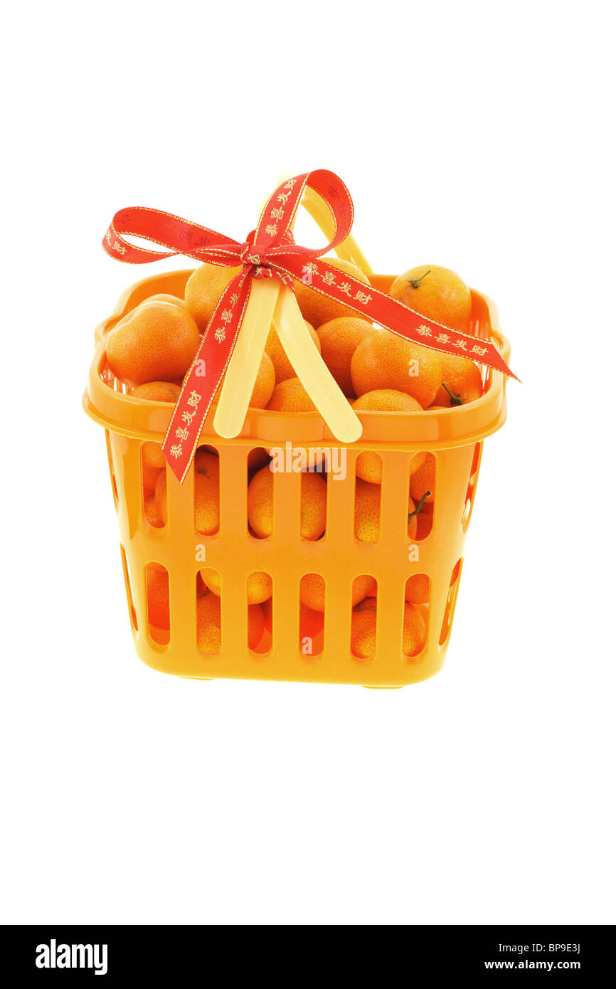 Basket full of mandarin oranges decorated with prosperous Chinese New ...