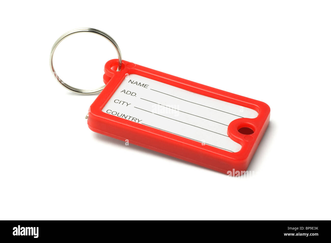 Red plastic key label on white background Stock Photo - Alamy