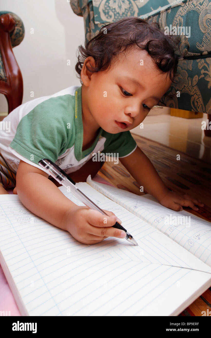 A child learning to write Stock Photo - Alamy