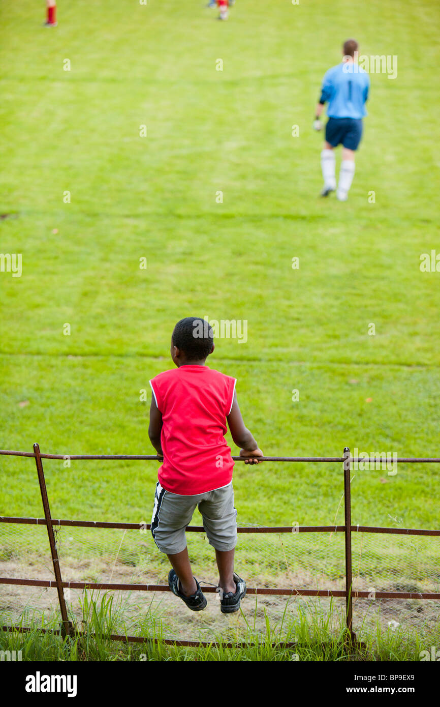 A child watches Ambleside FC playing Ulverston Town football club at ...