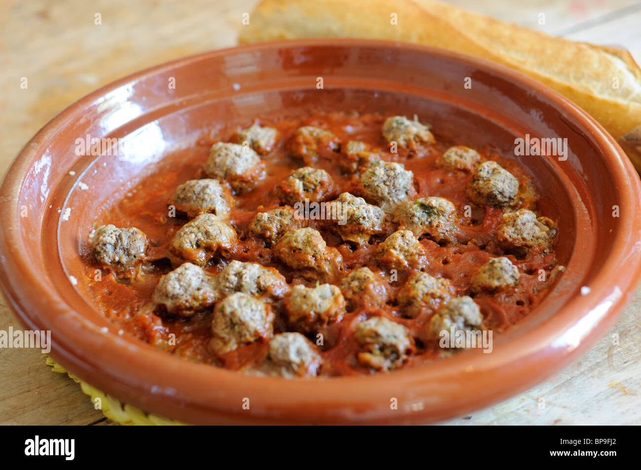 A Moroccan 'Fes' kefta tajine in a traditional Arabic tajine ...