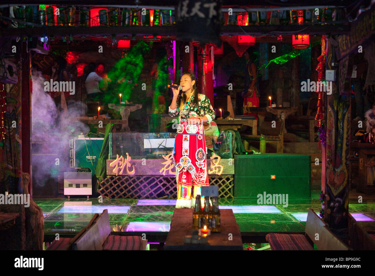 Bar entertainment singing in old town, Lijiang, Yunnan Province, China ...