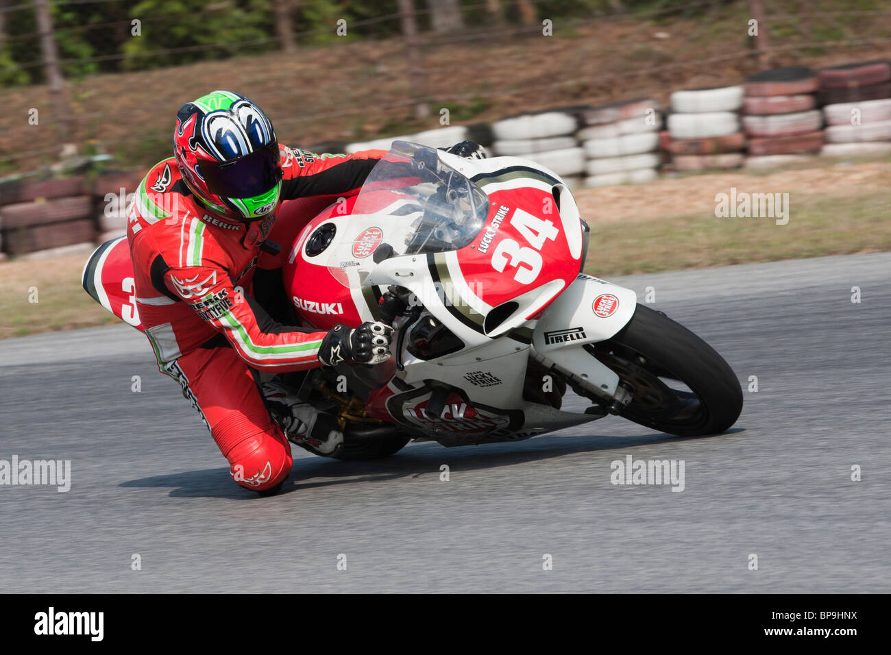 Motorcycle competitor cornering at high speed on a race circuit Stock ...