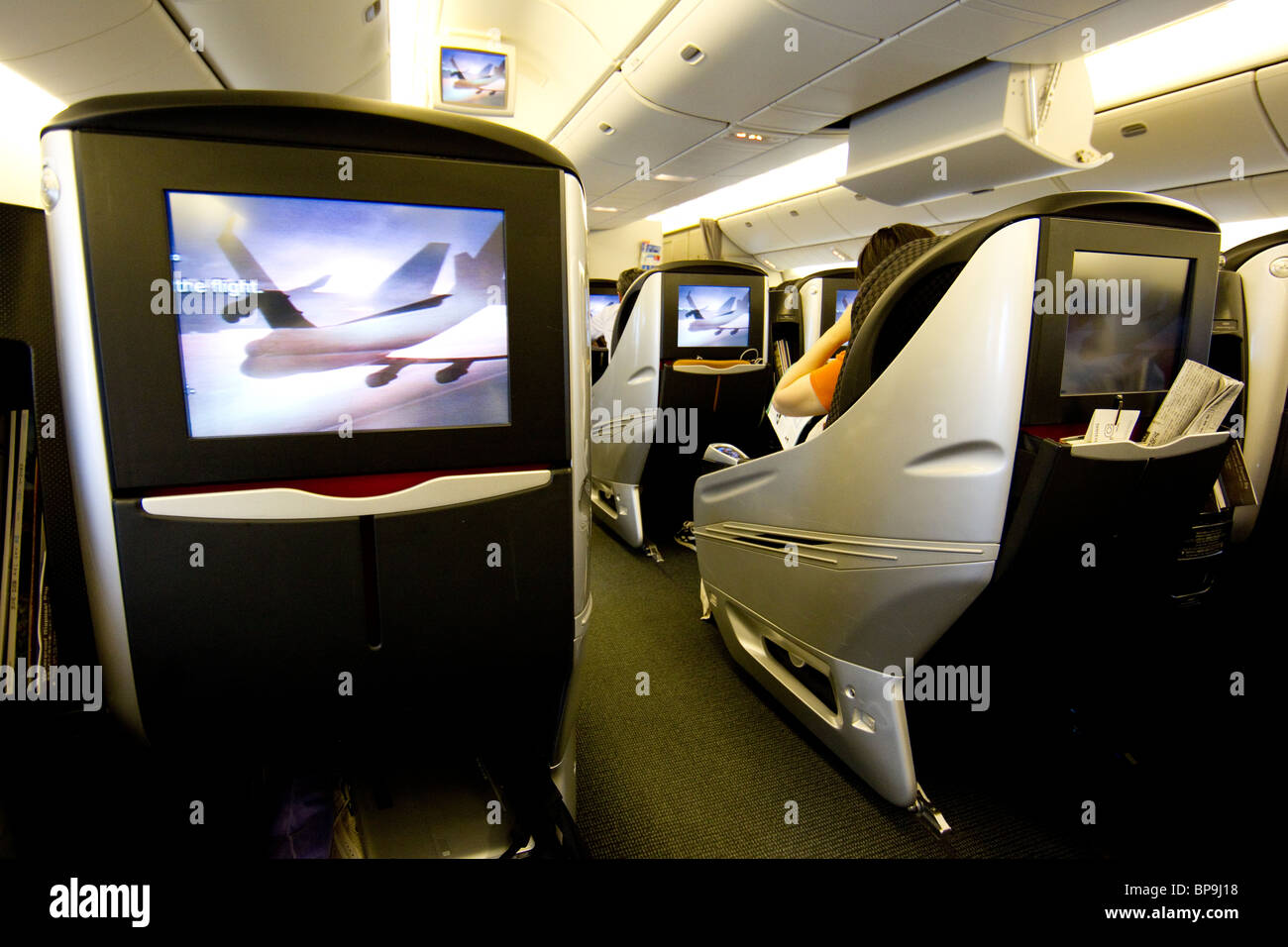 Interior of an airplane during a flight to Indonesia Stock Photo - Alamy