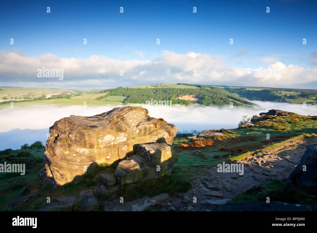 A misty Spring morning viewed from Curbar Edge looking over the mist ...