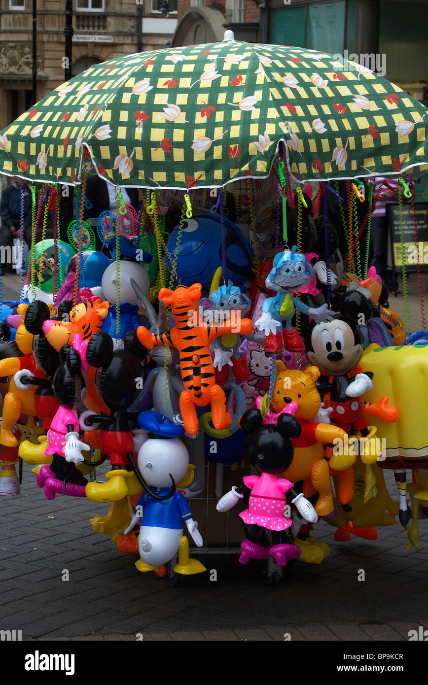 Cartoon animals hang from a sales stalls Stock Photo - Alamy