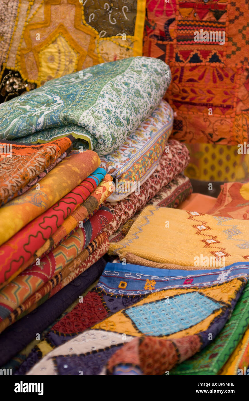 Piles of very colorful folded pieces of textile Stock Photo - Alamy