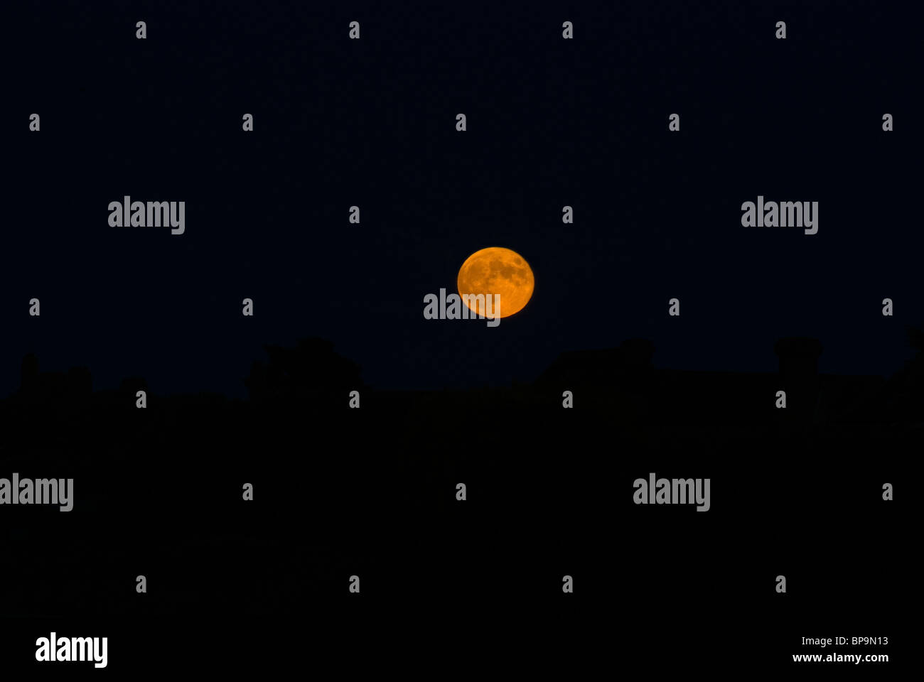 moon at sunset Stock Photo - Alamy