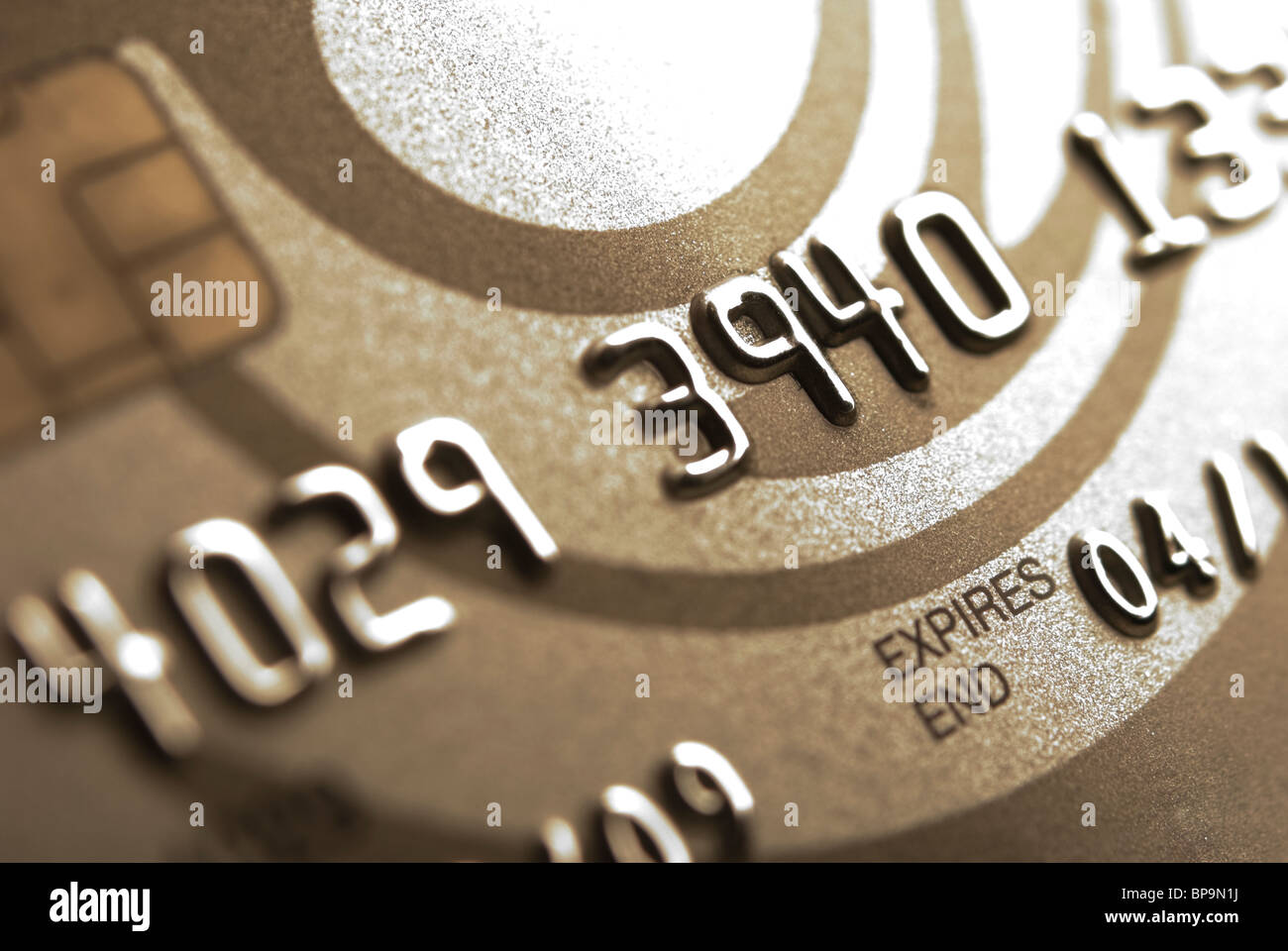 Details of a gold credit card with chip and some numbers, shallow DOF ...