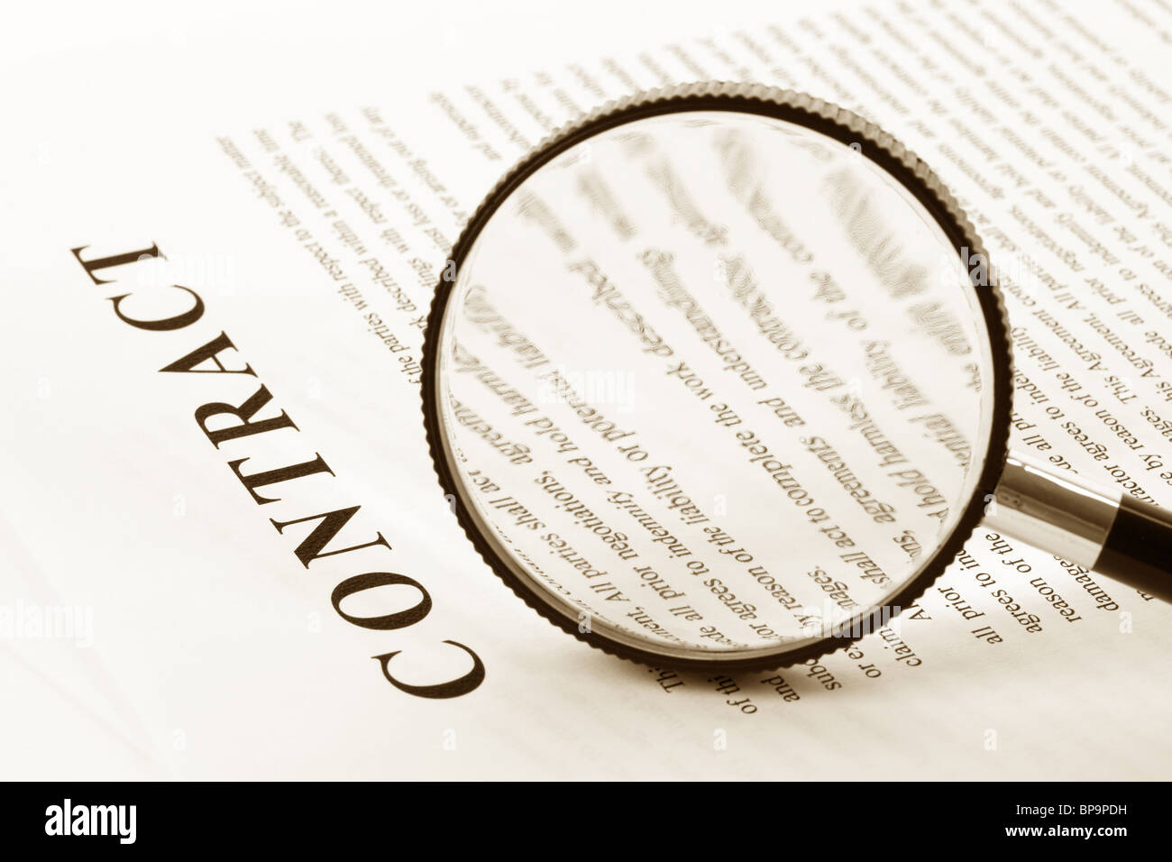 Magnifying Glass and document close up Stock Photo - Alamy