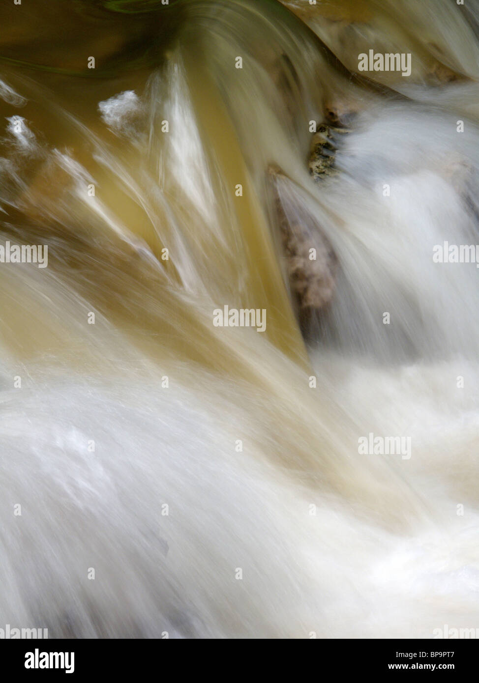 Water running over rocks with motion blur Stock Photo - Alamy