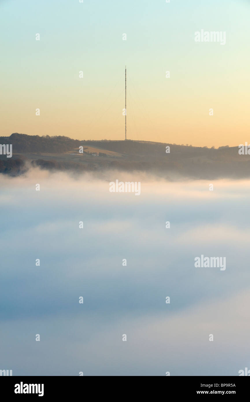 Pen Hill on the Mendip Hills in Somerset seen above thick fog on a ...