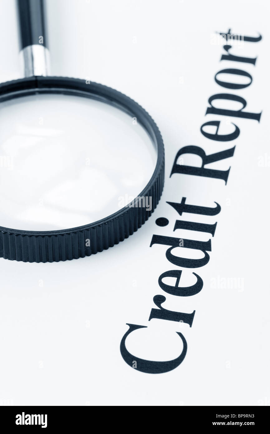 Credit Report and Magnifying Glass Stock Photo - Alamy
