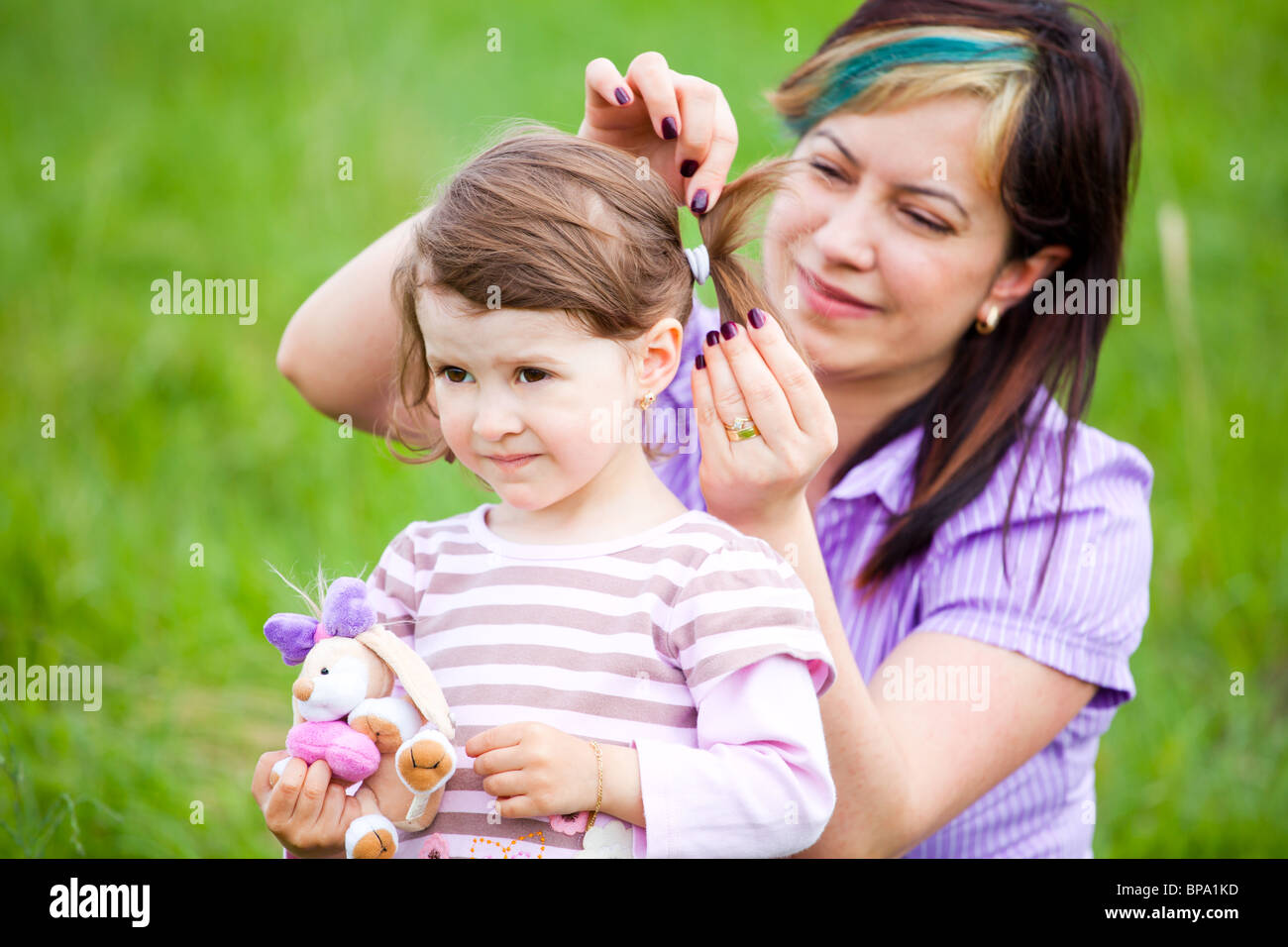 Mother spending a spring day outdoor with her little girl Stock Photo ...