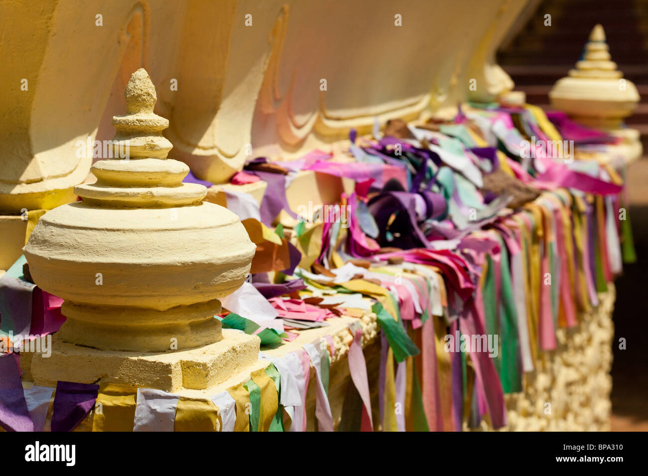 Burial stupa covered with colorful paper stripes at a traditional ...