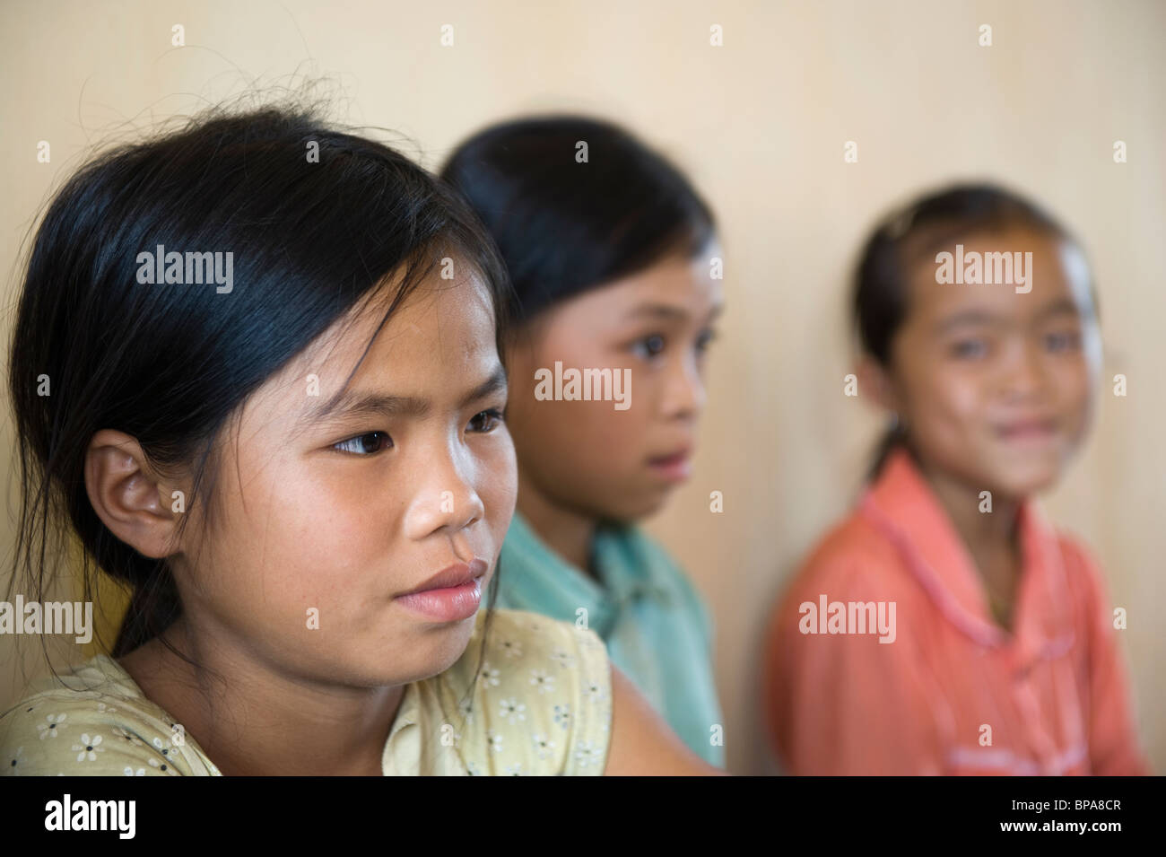 Three girls in a community classroom in Na Bai, a village in North West ...