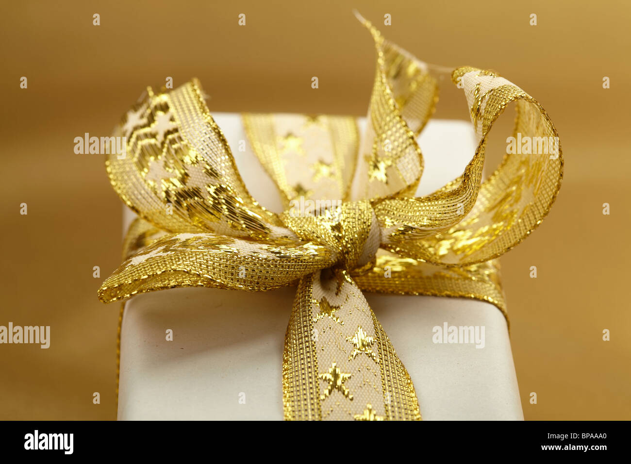 gift box with gold ribbon Stock Photo - Alamy