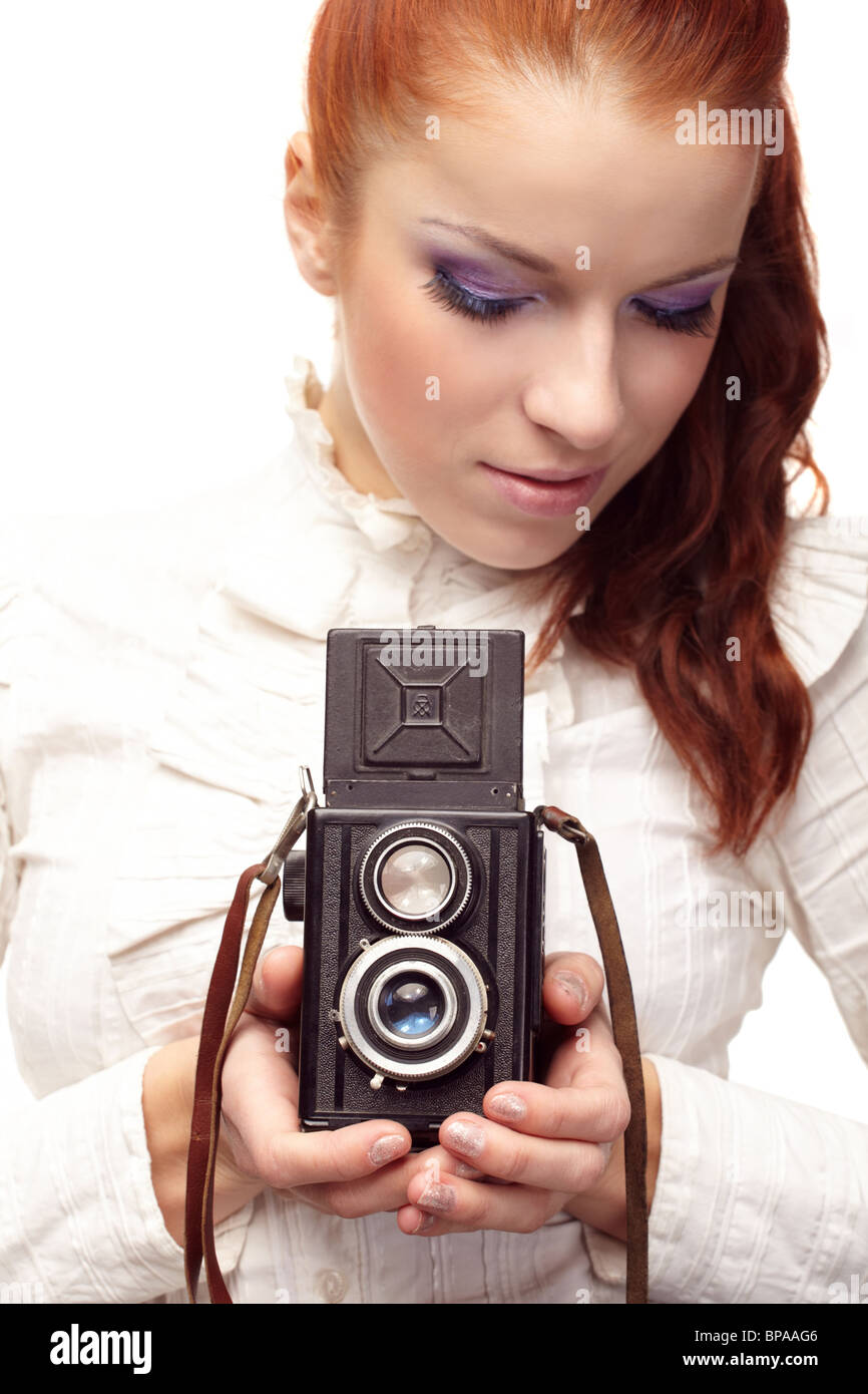 Beautiful young woman with camera Stock Photo - Alamy