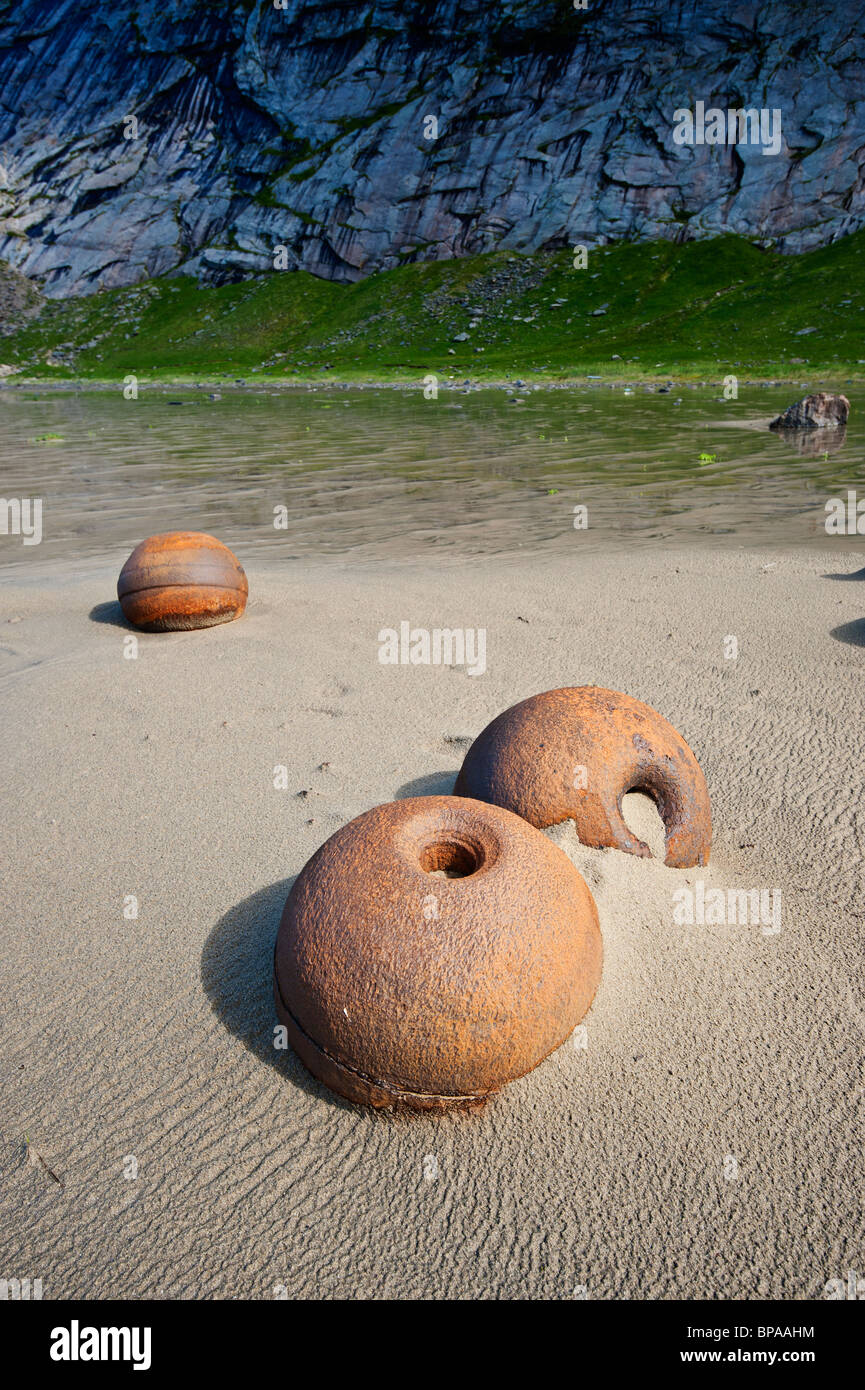 Rusting metal bouys on Bunes beach, Lofoten islands, Norway Stock Photo ...