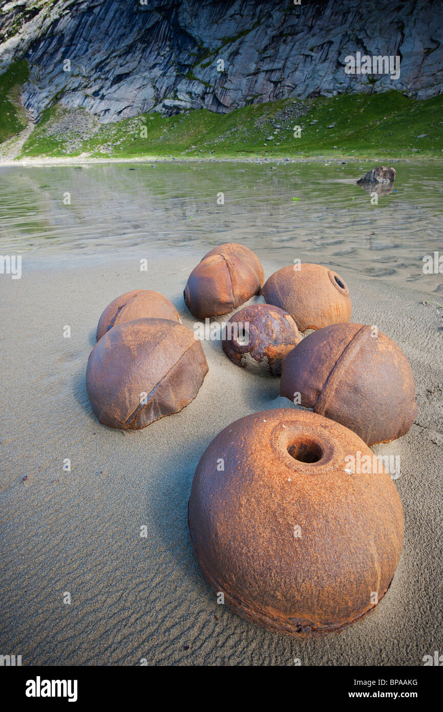 Rusting metal bouys on Bunes beach, Lofoten islands, Norway Stock Photo ...