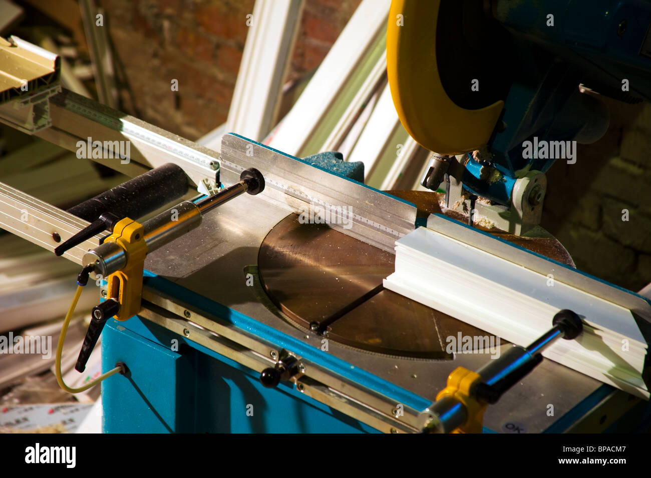 Saw machine cut plastic - window manufacture Stock Photo - Alamy