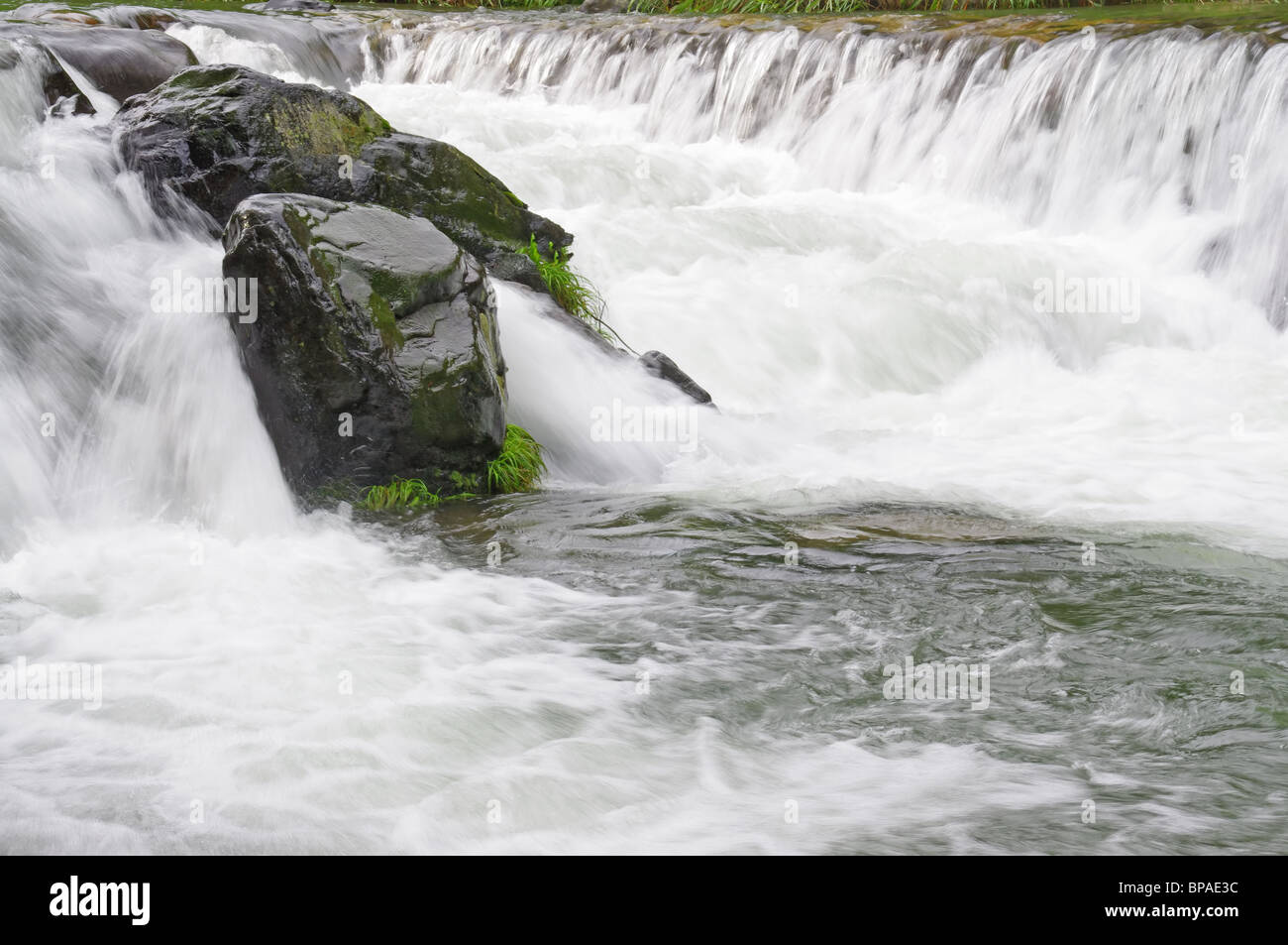 Water spilling over rocks hi-res stock photography and images - Alamy