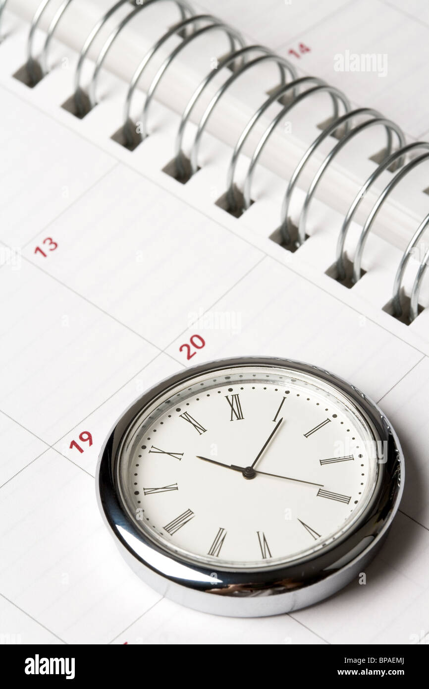 calendar and clock close up shot Stock Photo - Alamy