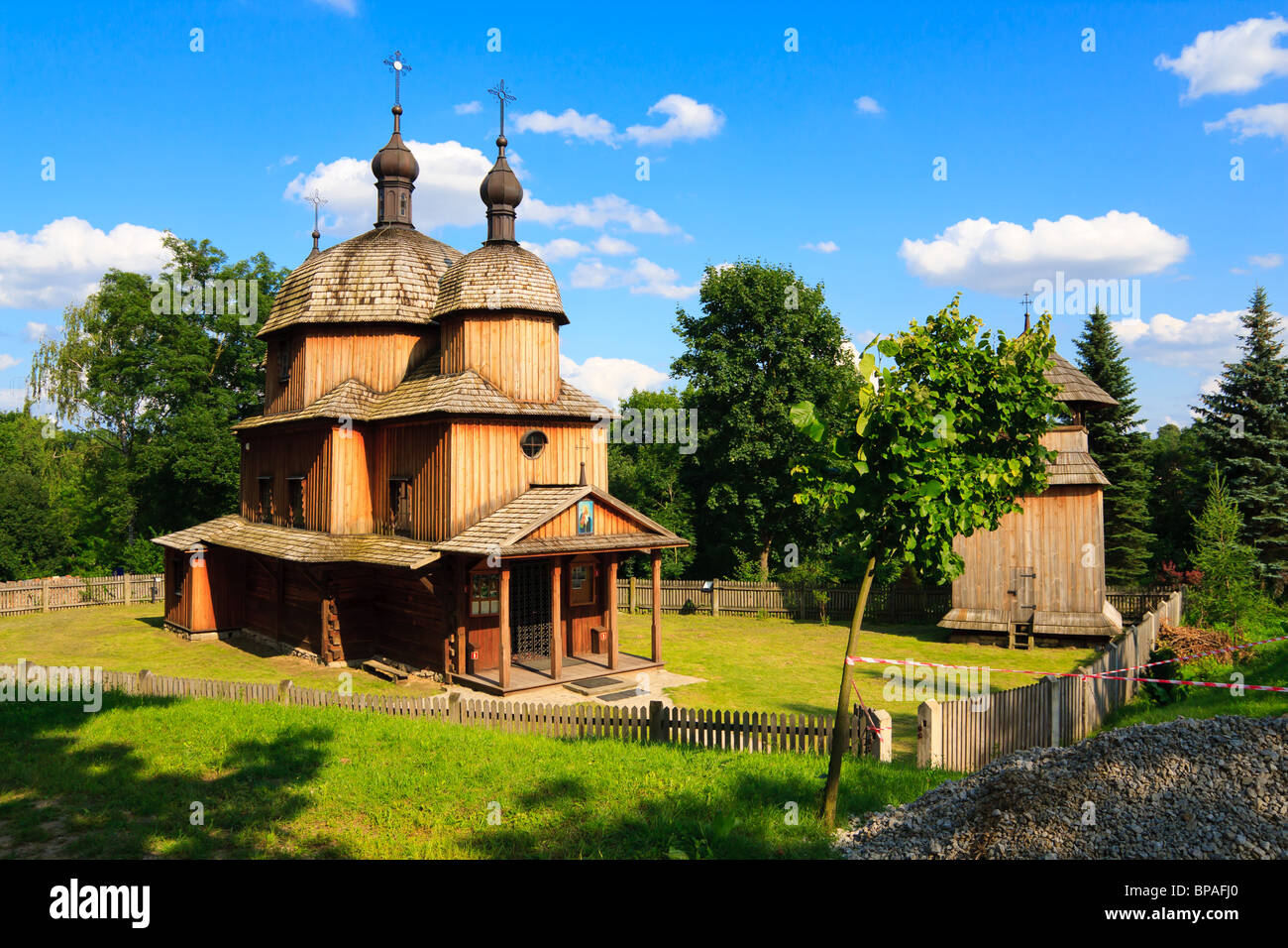 Historical wooden church in polish heritage park. Blue sky and clouds ...