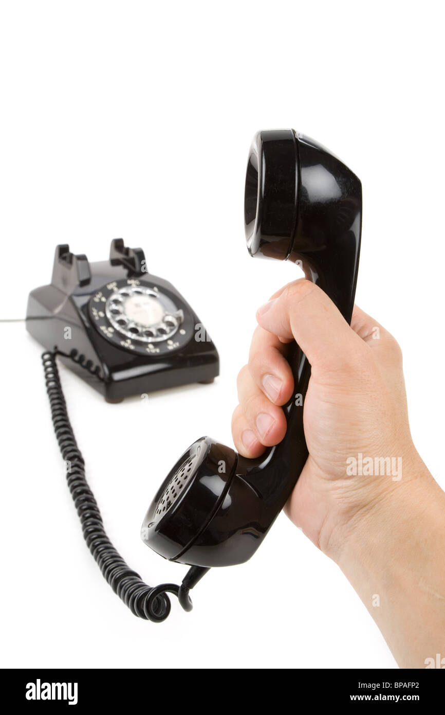 Hand holding Black telephone Receiver with white background Stock Photo ...