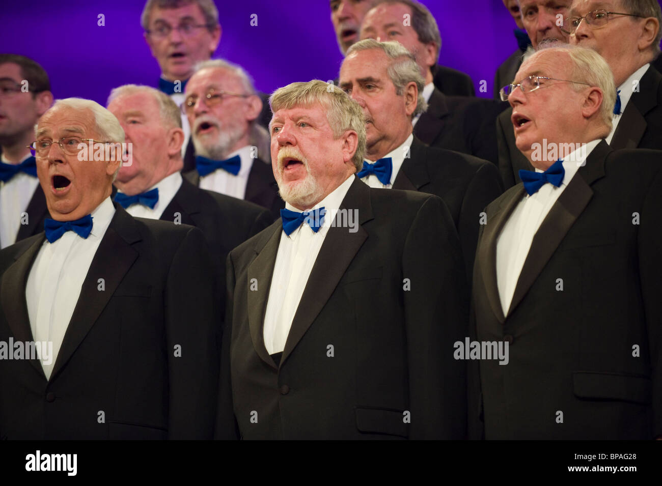 Male voice choir singing on stage in competition at the National ...