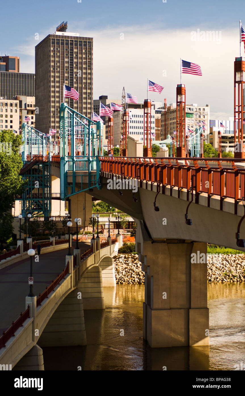 US flags line the Wabasha Street bridge over the Mississippi River on a ...