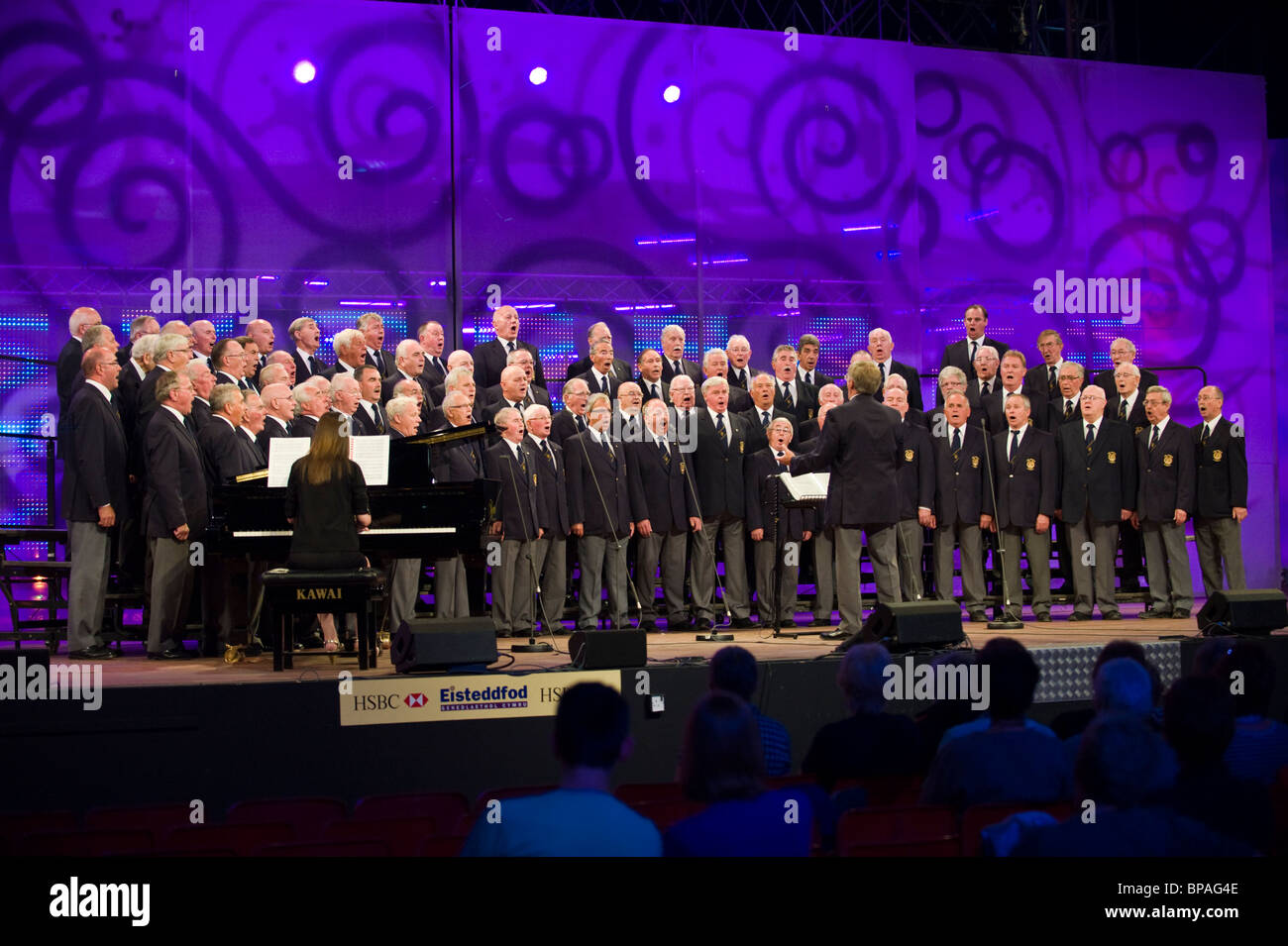 Male voice choir singing on stage in competition at the National ...